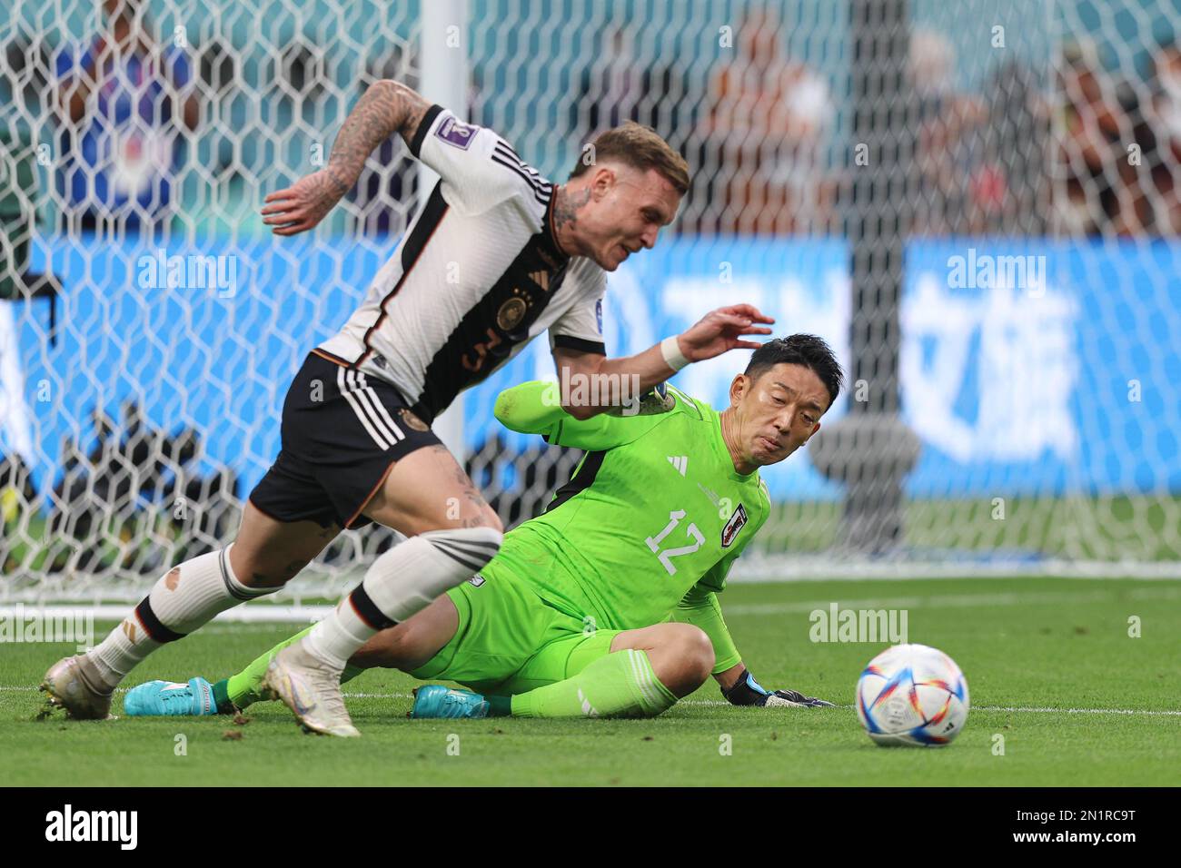 AR-RAJJAN, QATAR - NOVEMBER 23: David Raum, Shuichi Gonda during the ...