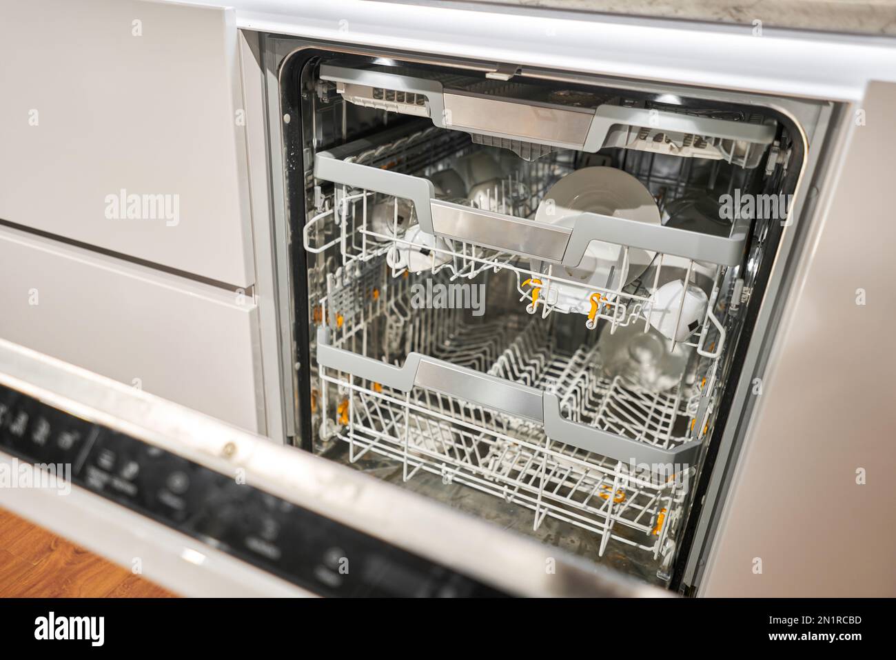Many of dirty dishes in the dishwasher. Built-in dishwashers with ...
