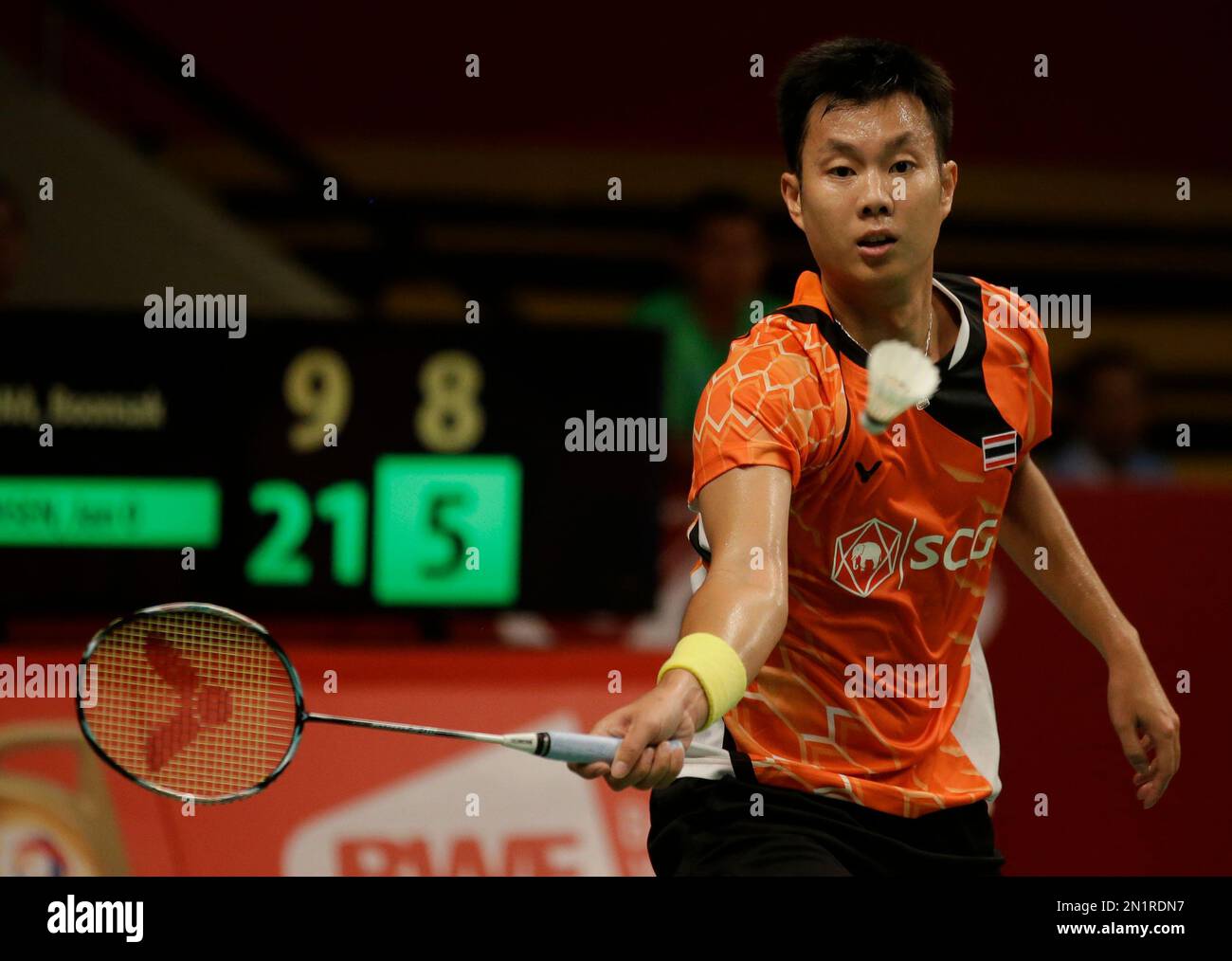 Thailand's Boonsak Ponsana returns a shot to Denmark's Jan O Jorgensen ...