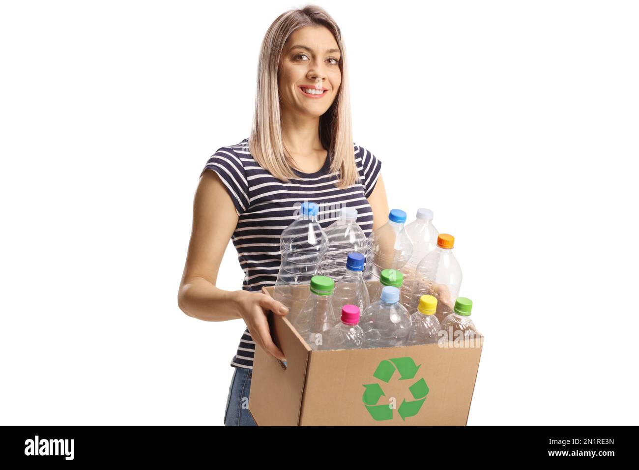 Young woman carrying a cardboard box with recycling plastic bottles ...