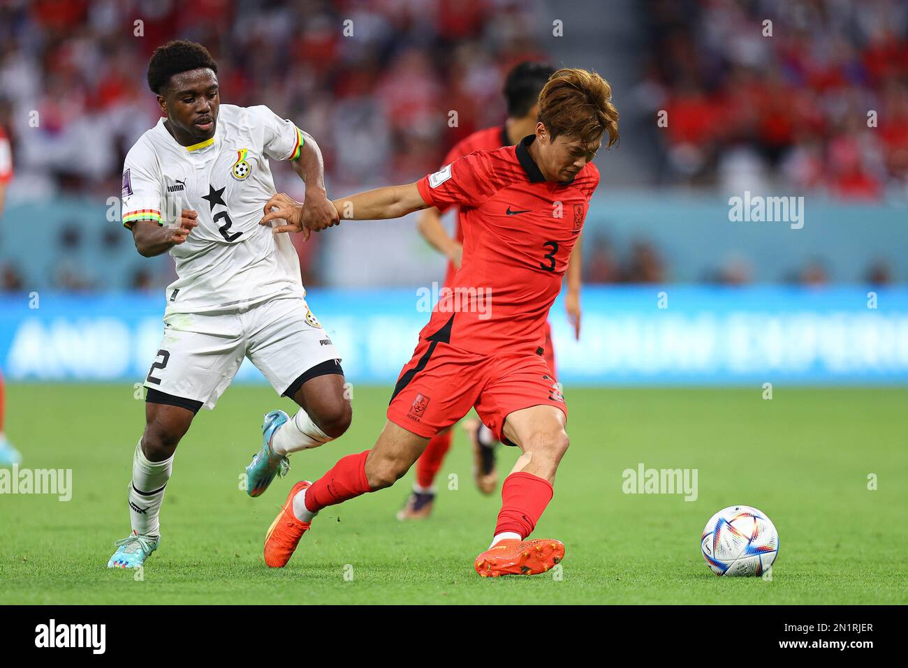 AL RAYYAN, QATAR - NOVEMBER 28: Tariq Lamptey, Jinsu Kim during the ...