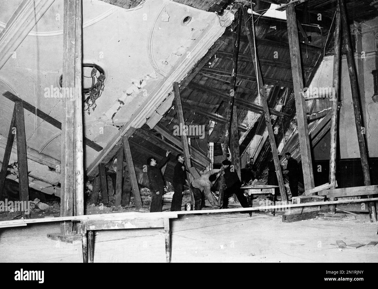 Workmen clean the hall of the wreckage in Burgerbraukeller in Munich ...
