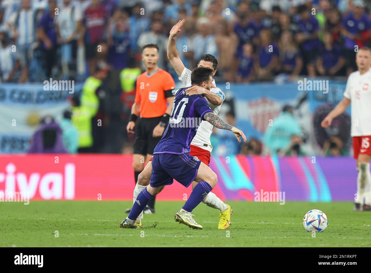DOHA, QATAR - NOVEMBER 30: Robert Lewandowski, Lionel Messi faul during ...