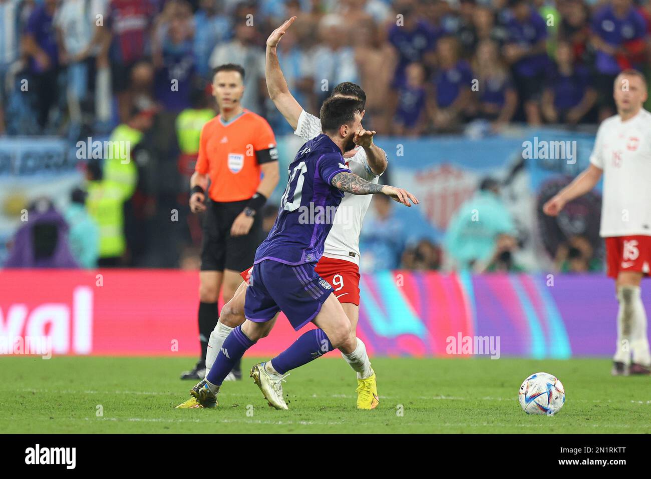DOHA, QATAR - NOVEMBER 30: Robert Lewandowski, Lionel Messi faul during ...