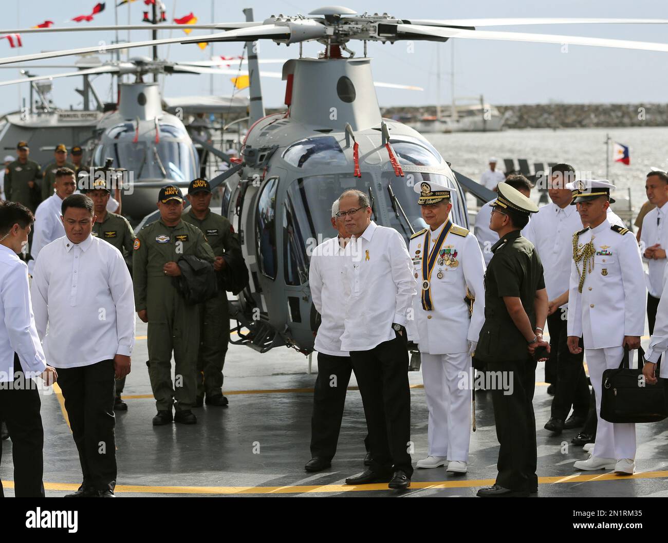 Philippine President Benigno Aquino III, center left, smiles beside new ...
