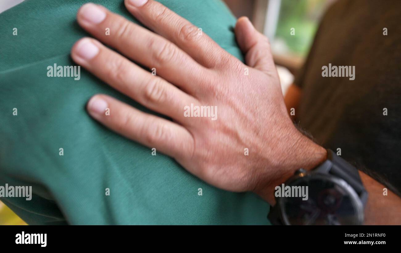 Hand caressing person back parents caresses family Stock Photo - Alamy