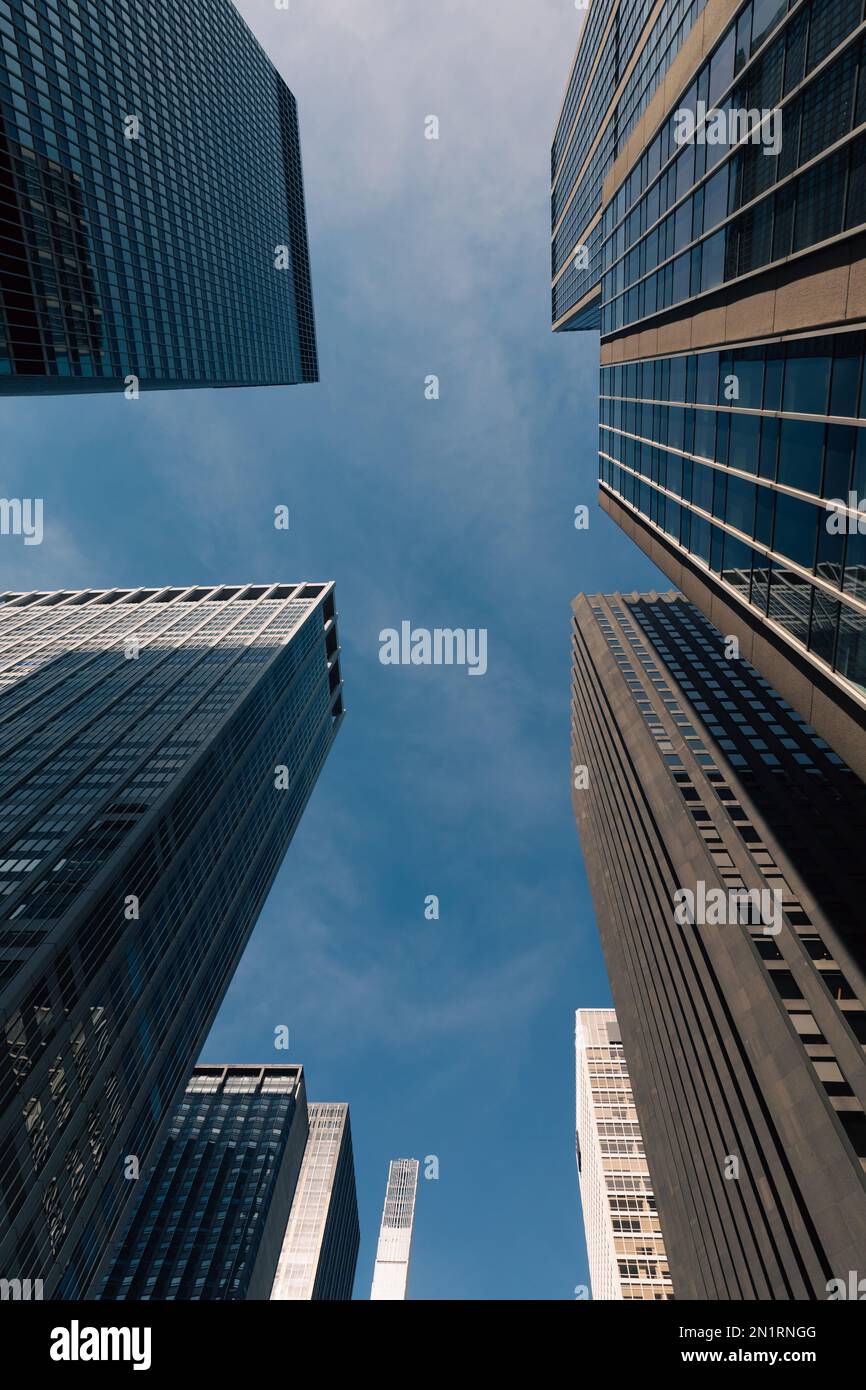 bottom view of contemporary high-rise buildings in Manhattan against ...