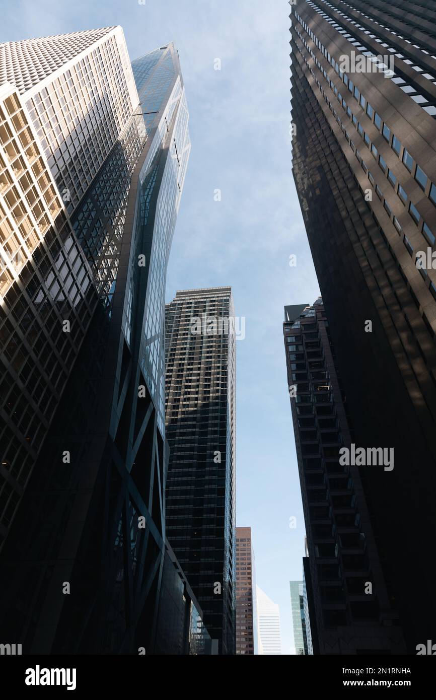 low angle view of facades of high-rise buildings in midtown of New York ...