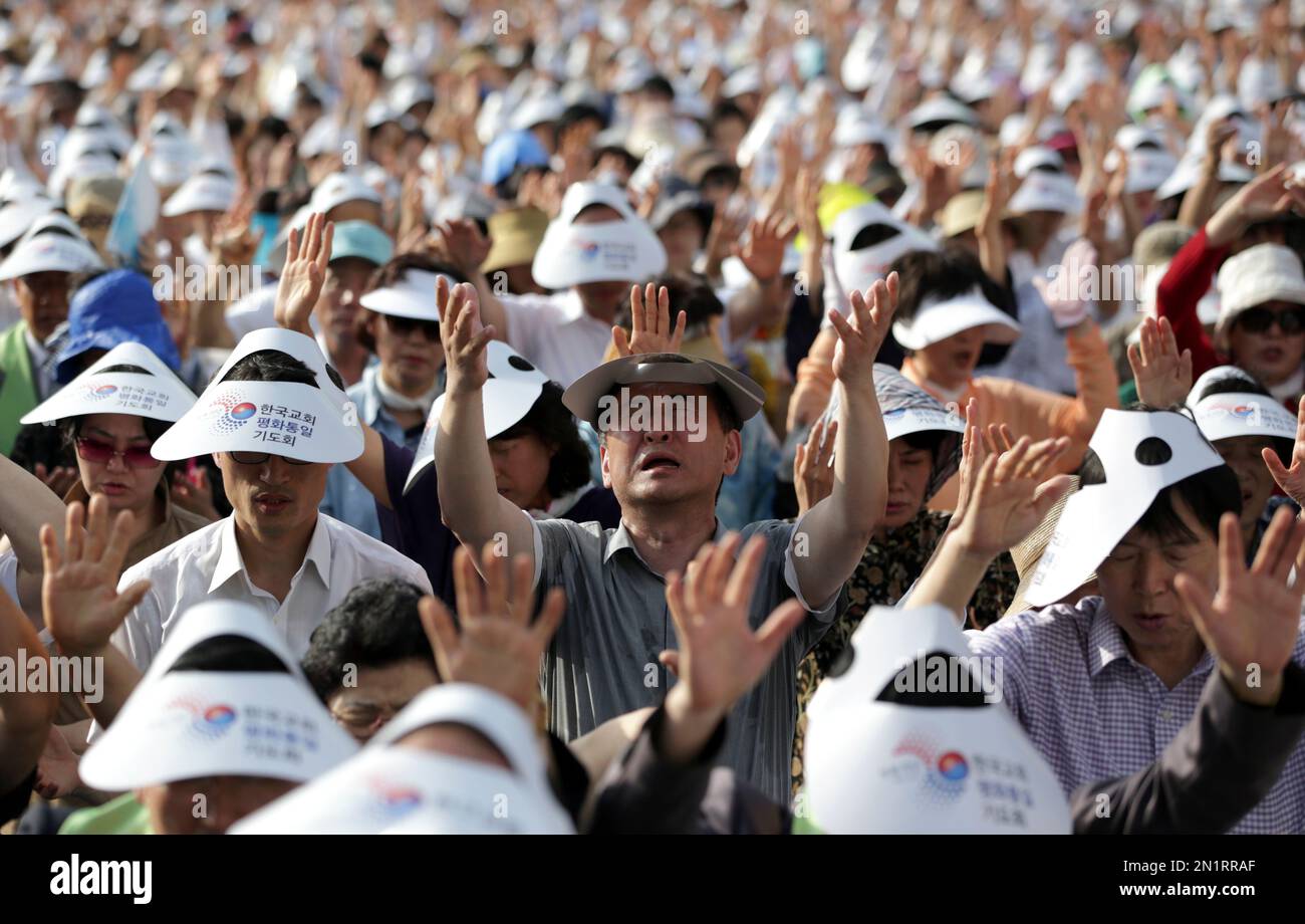 South Korean Christians pray during a service to wish for a peaceful ...