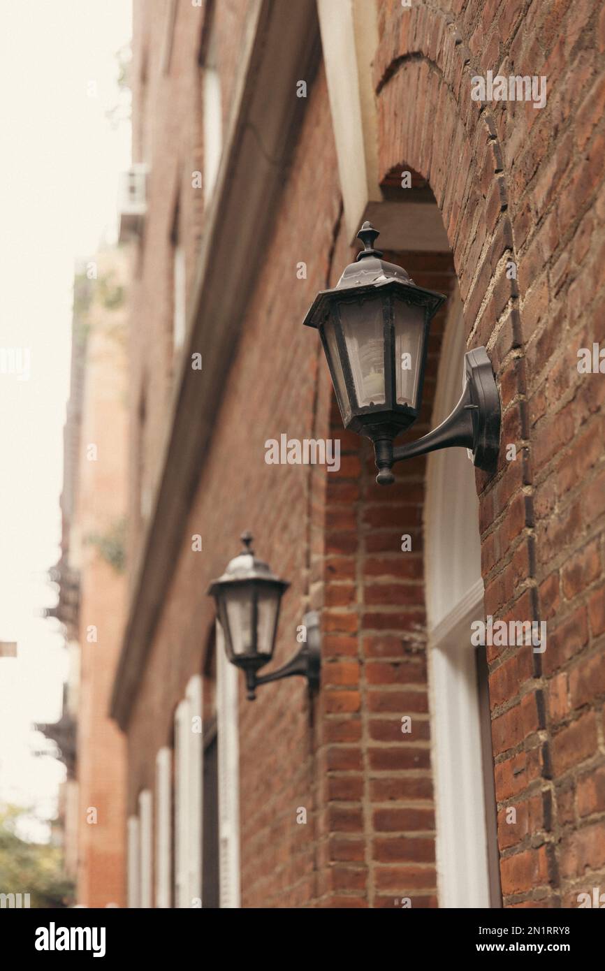 Lanterns on brick facade of building in New York City,stock image Stock ...