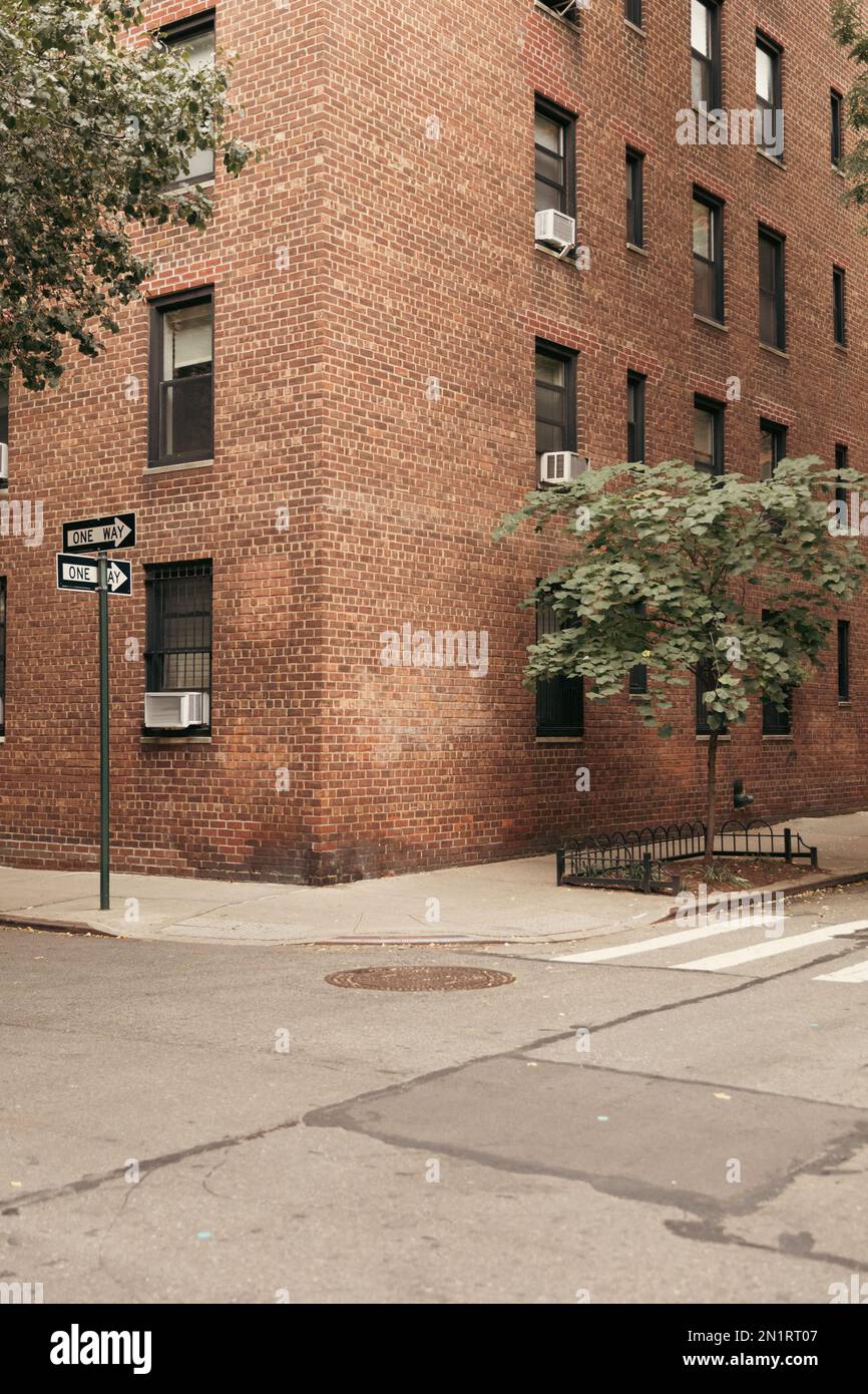 Pointers and trees near brisk building on street in New York City,stock ...