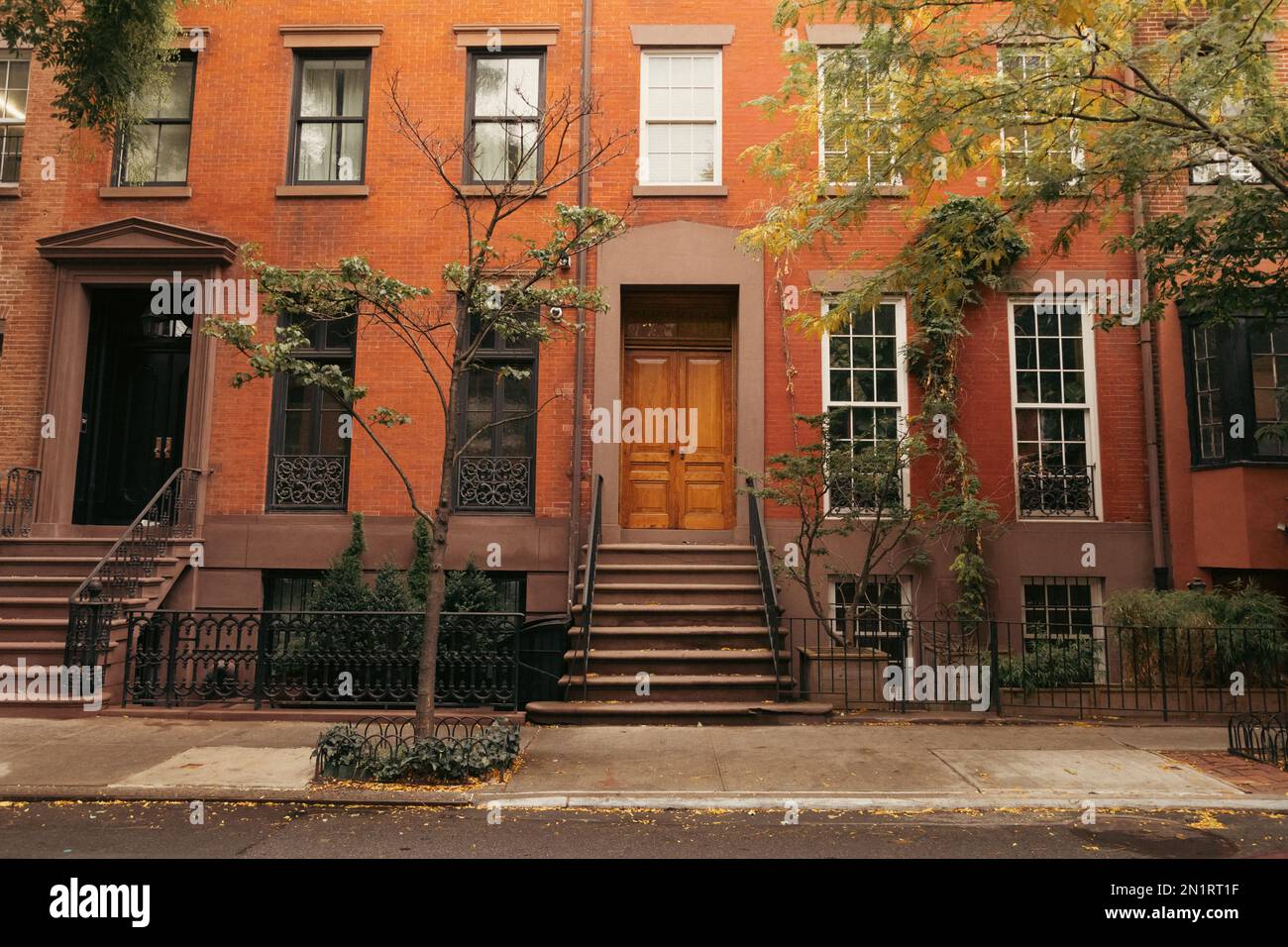 Facade of building with steps and doors on urban street in brooklyn ...