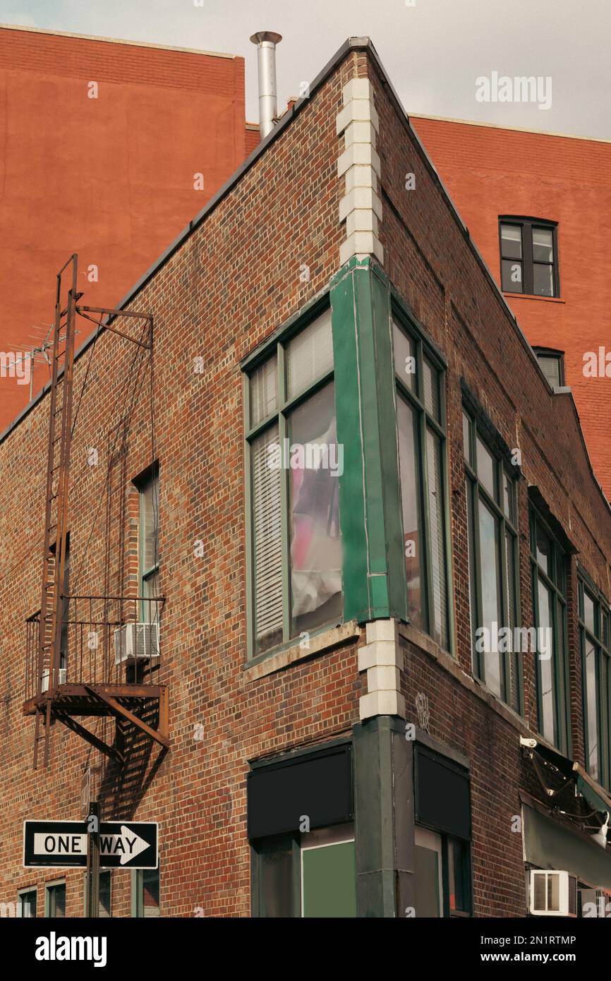 Corner of brick building with fire escape on street in Manhattan,stock ...