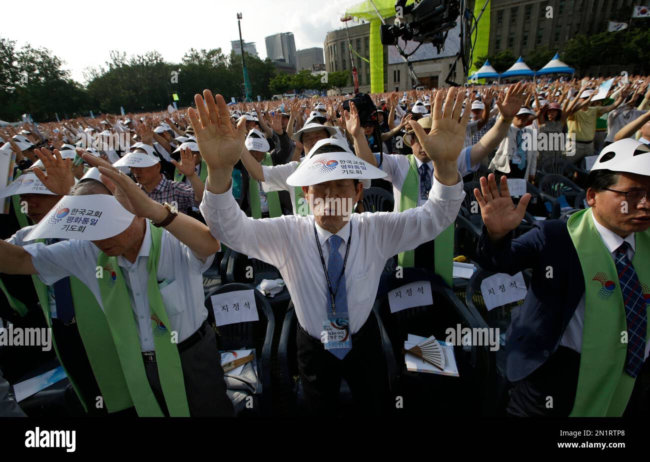 South Korean Christians pray during a service to wish for a peaceful ...