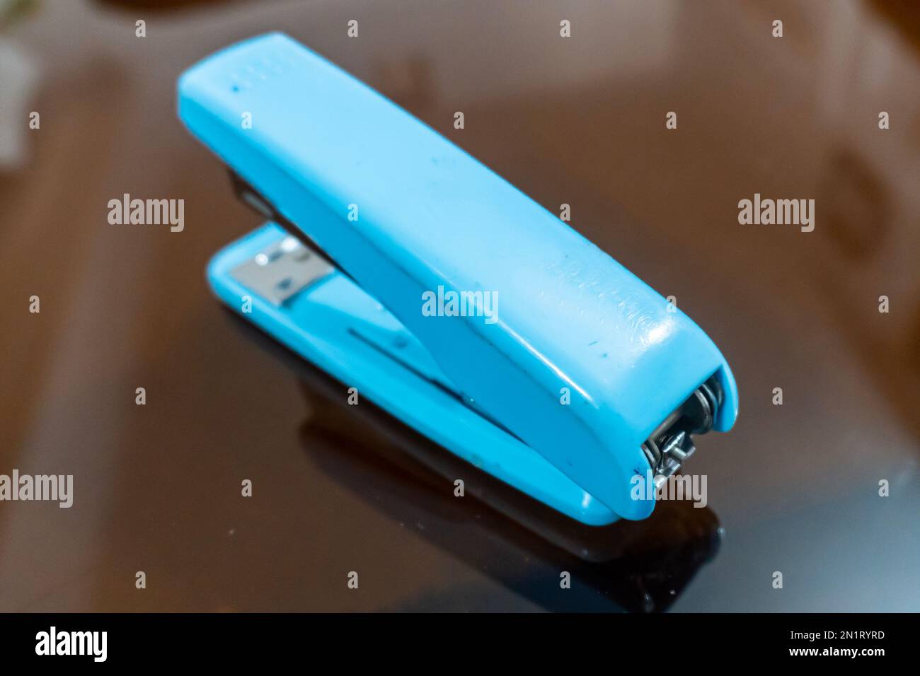 Side view of light blue stapler isolated on glass background Stock ...