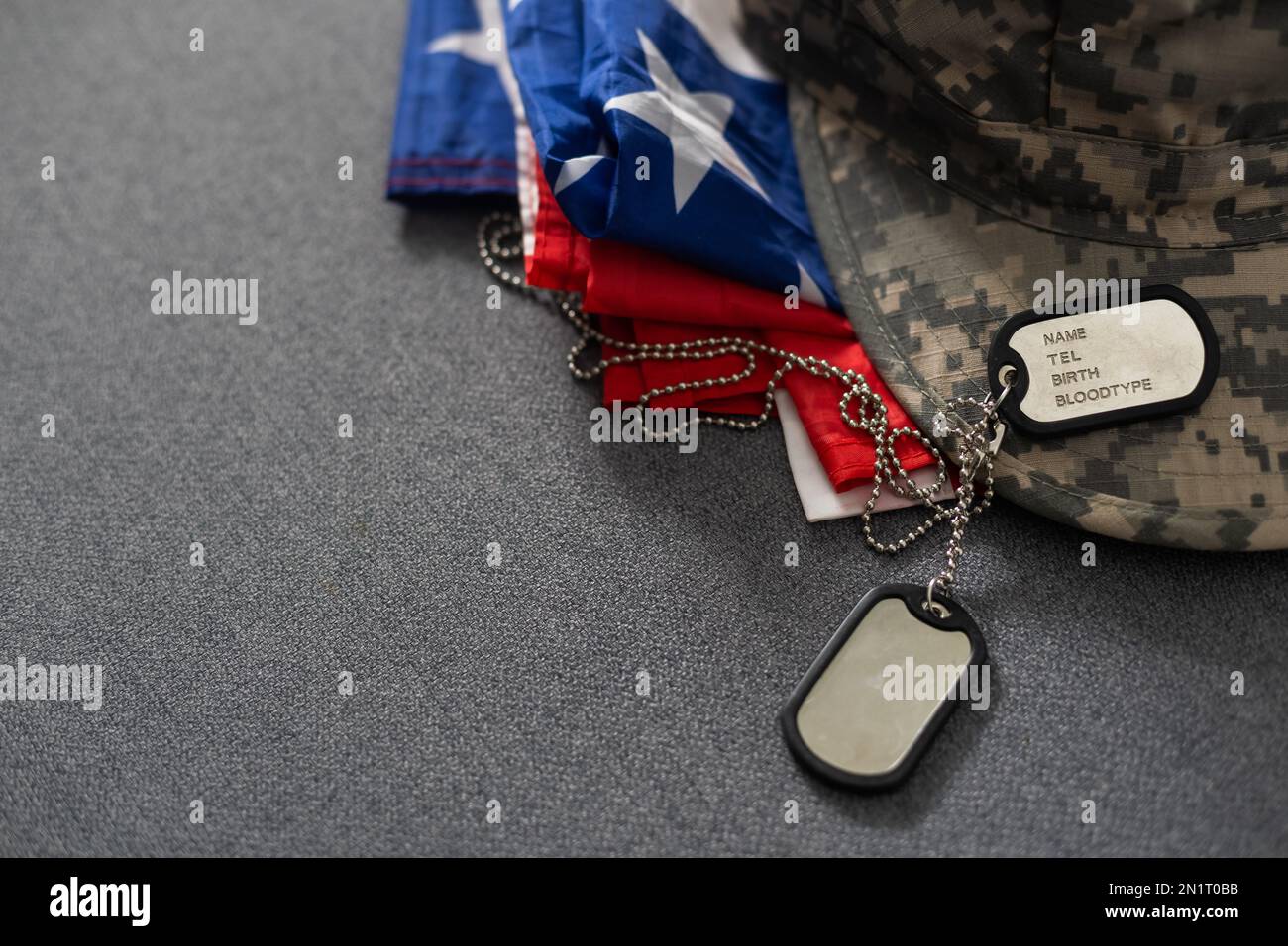 Army tokens on military uniform and USA national flag background Stock ...