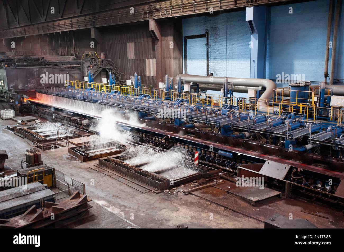 Metallurgical factory in Germany, hot rolled metal conveyor, sheet steel production Stock Photo ...