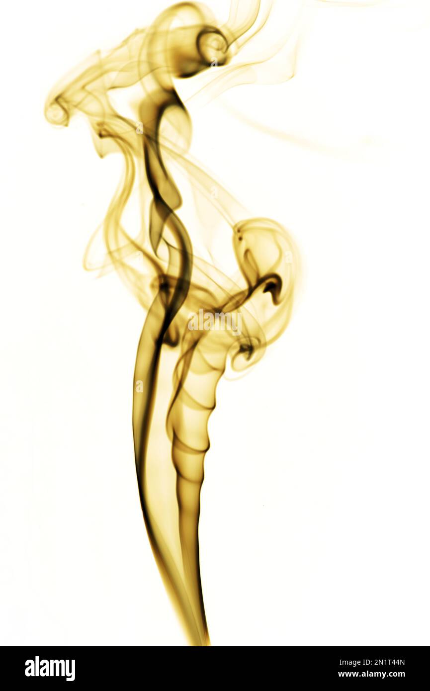 Puffs and curls of dark smoke on a white background rising from a ...