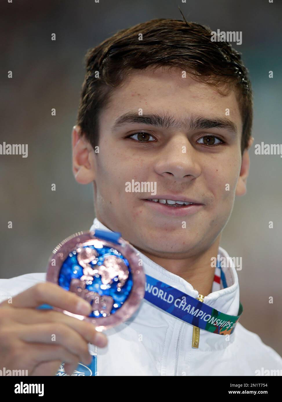 Russia's Evgeny Rylov holds his bronze medal after his third place ...