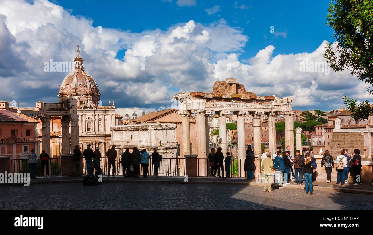 Tourism in Rome. Tourists and visitors taking photos of Roman Forum ...