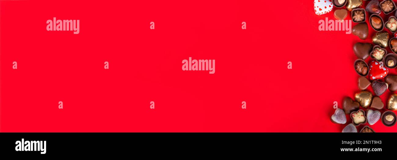 Valentines Day chocolates banner, background, frame. Various sweets and ...