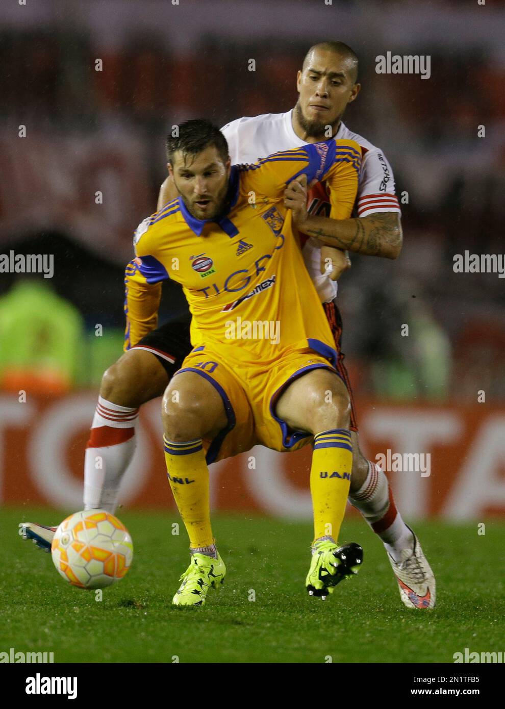 Andre Gignac of Mexico's Tigres, left, fights for the ball with Jonatan ...