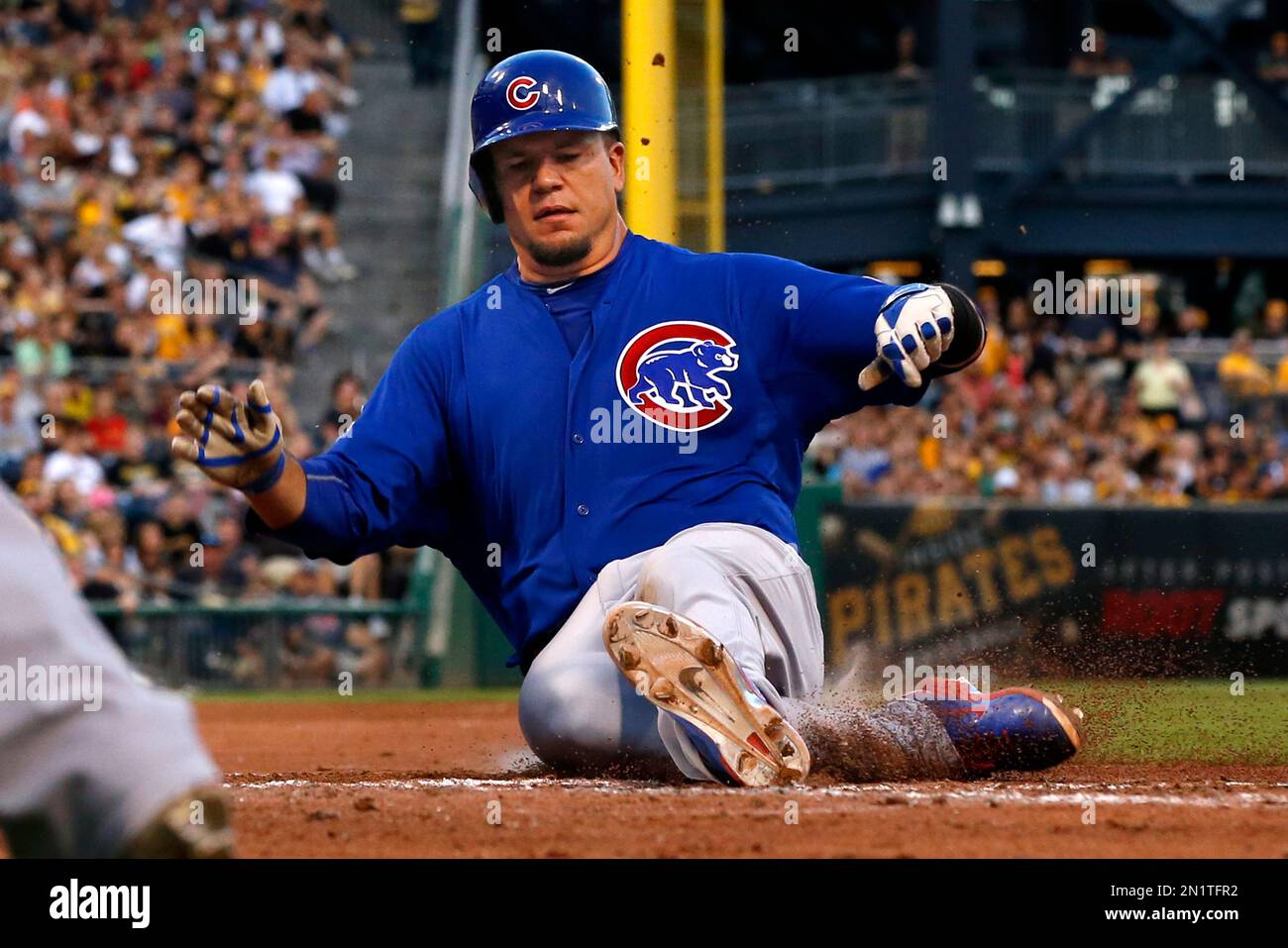 Chicago Cubs' Kyle Schwarber scores on a sacrifice fly by Anthony Rizzo ...