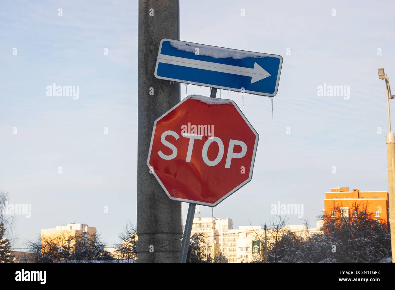 Road stop signs and post arrow close up Stock Photo - Alamy