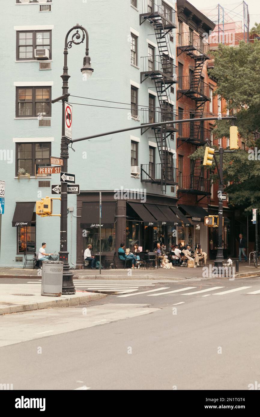 NEW YORK, USA - OCTOBER 11, 2022: Cafe on corner of building on street ...