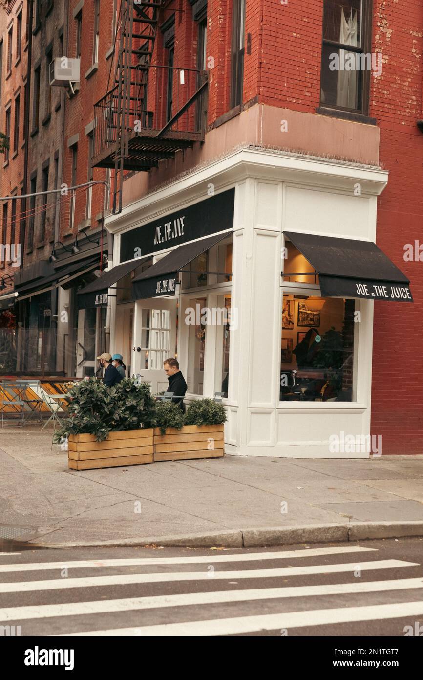 NEW YORK, USA - OCTOBER 11, 2022: Cafe with terrace on sidewalk in ...