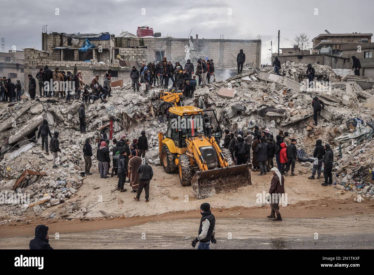 Harem, Syria. 06th Feb, 2023. Rescue workers and civilians conduct ...