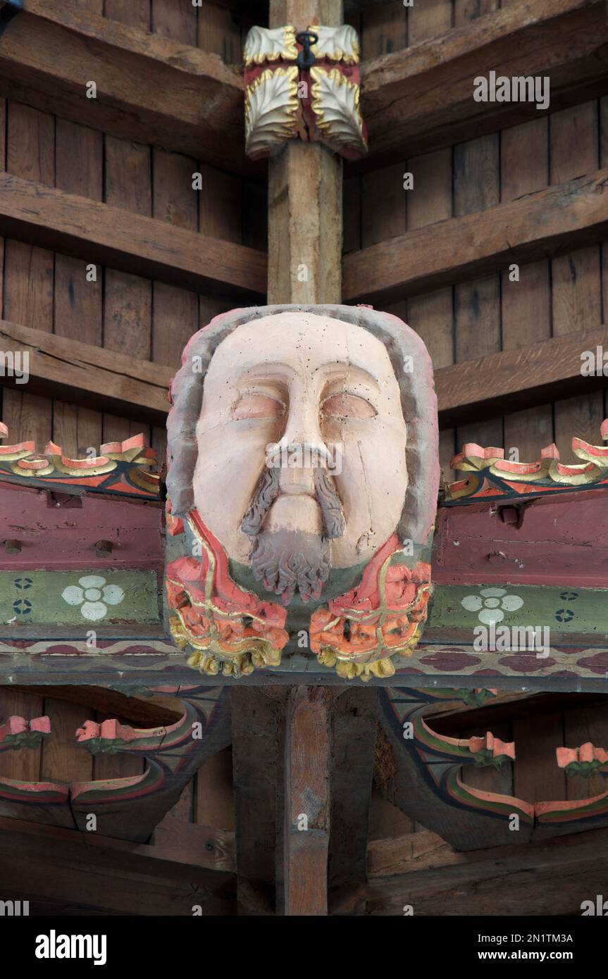 A representation of Cardinal Morton's face carved into a ceiling boss ...