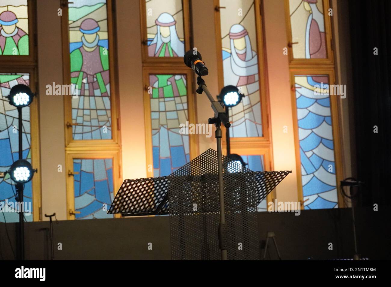 A microphone on the background of a stained glass window Stock Photo ...