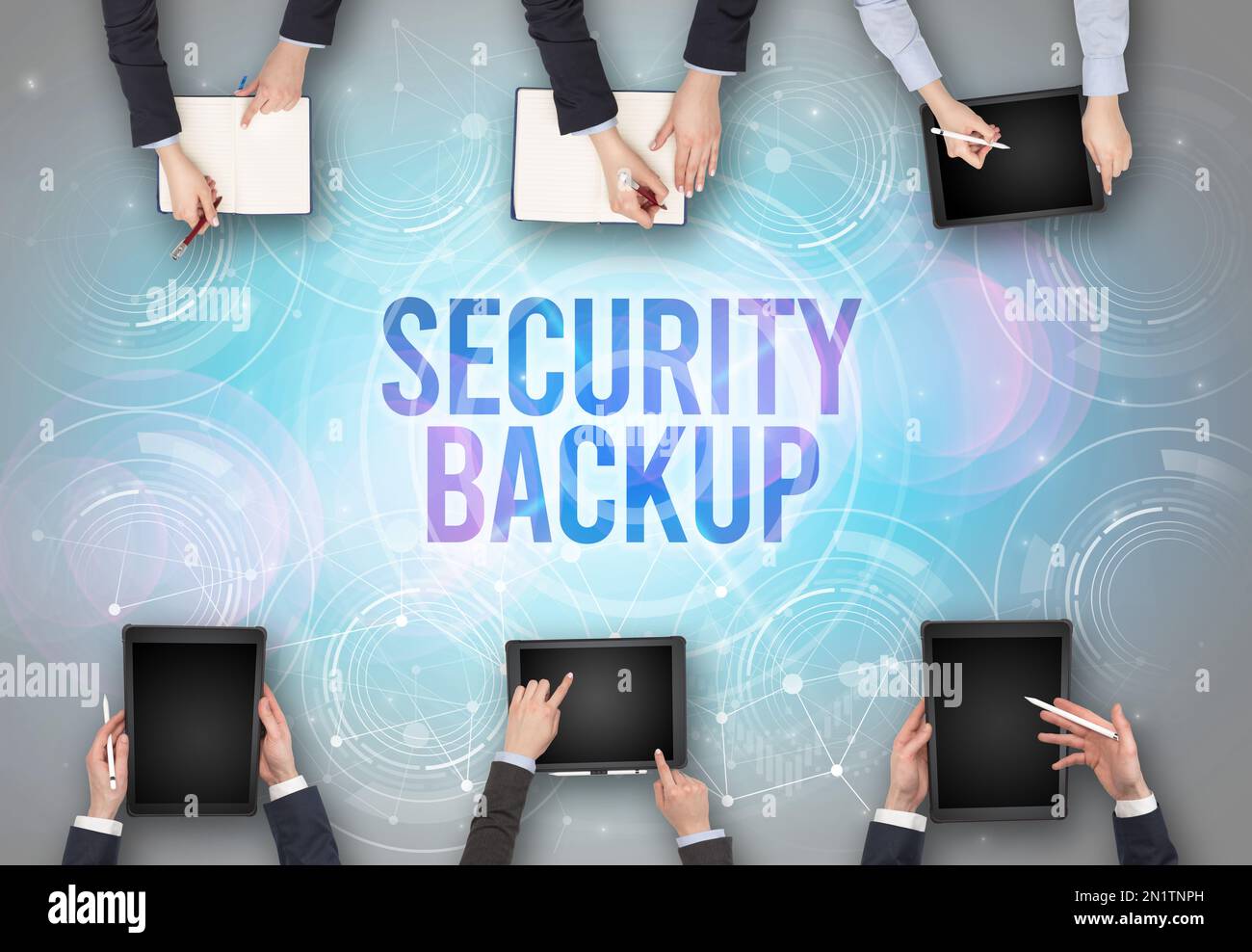 Group of people in front of a laptop, security concept Stock Photo - Alamy