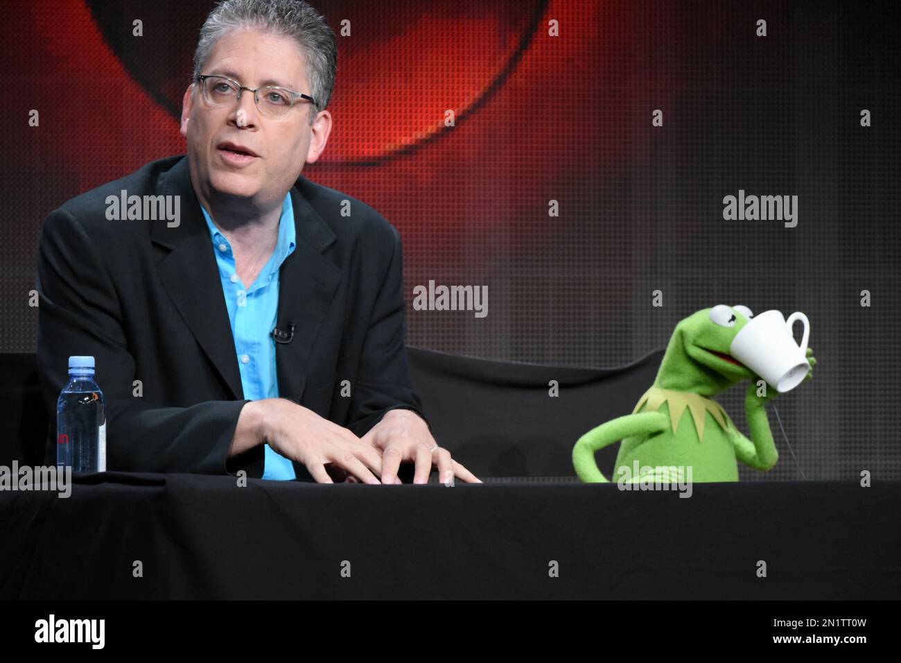 Kermit the Frog takes a sip from his mug at "The Muppets" panel at the ...