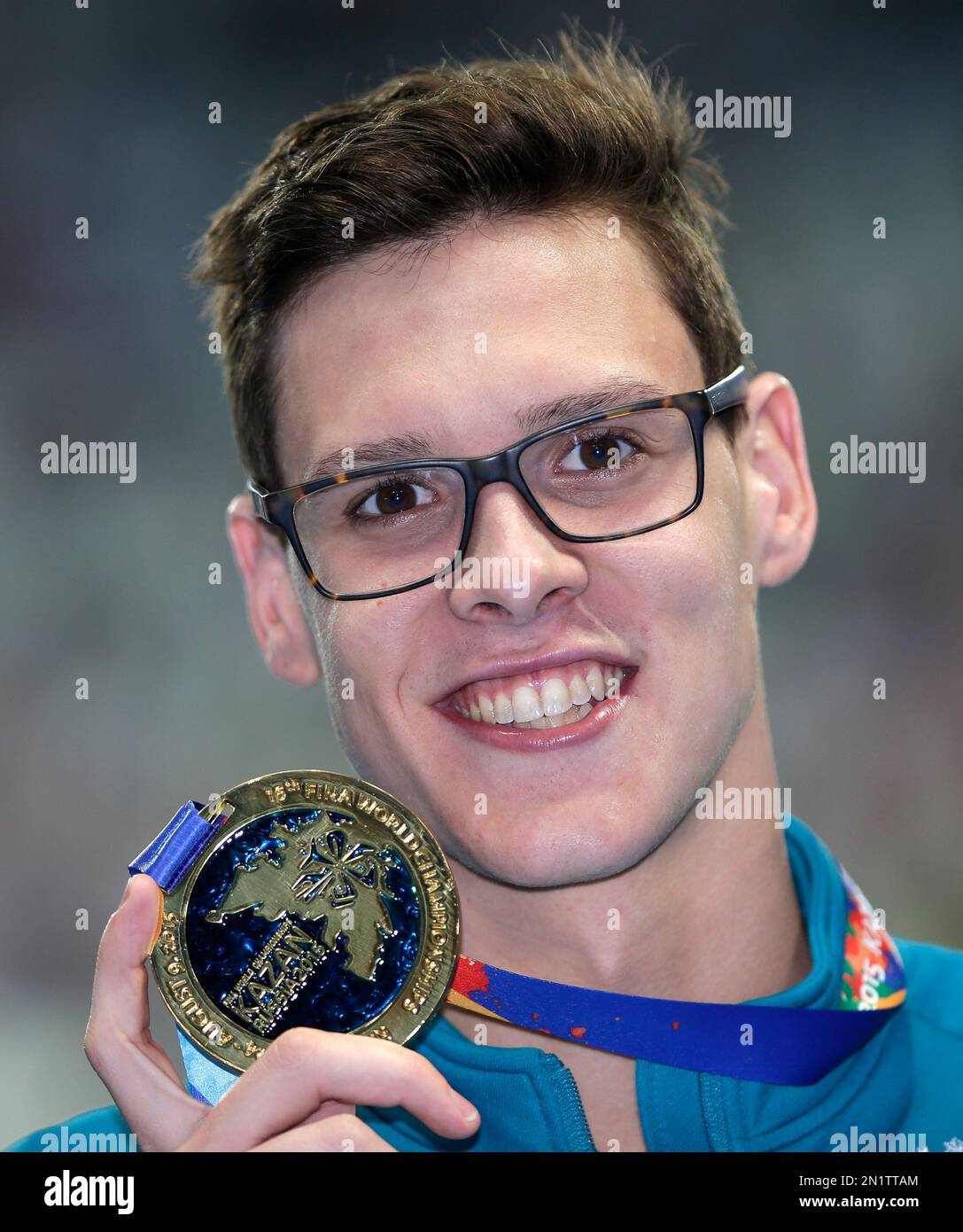 Australia's Mitchell Larkin holds his gold medal after winning the men ...