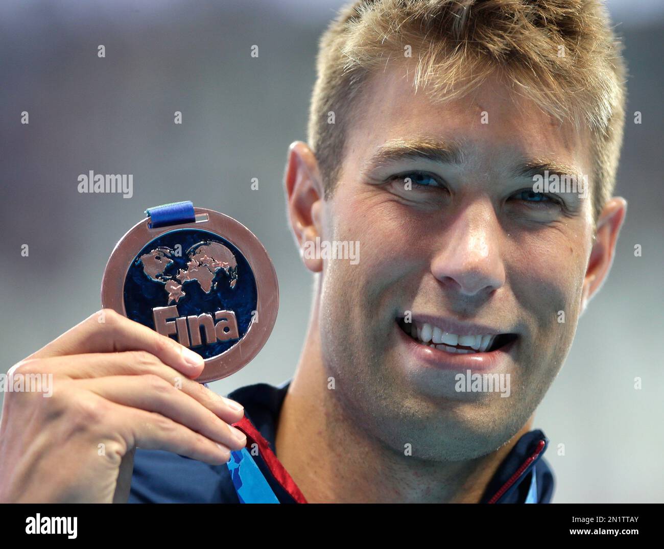 United States' Matt Grevers holds his bronze medal after his third ...