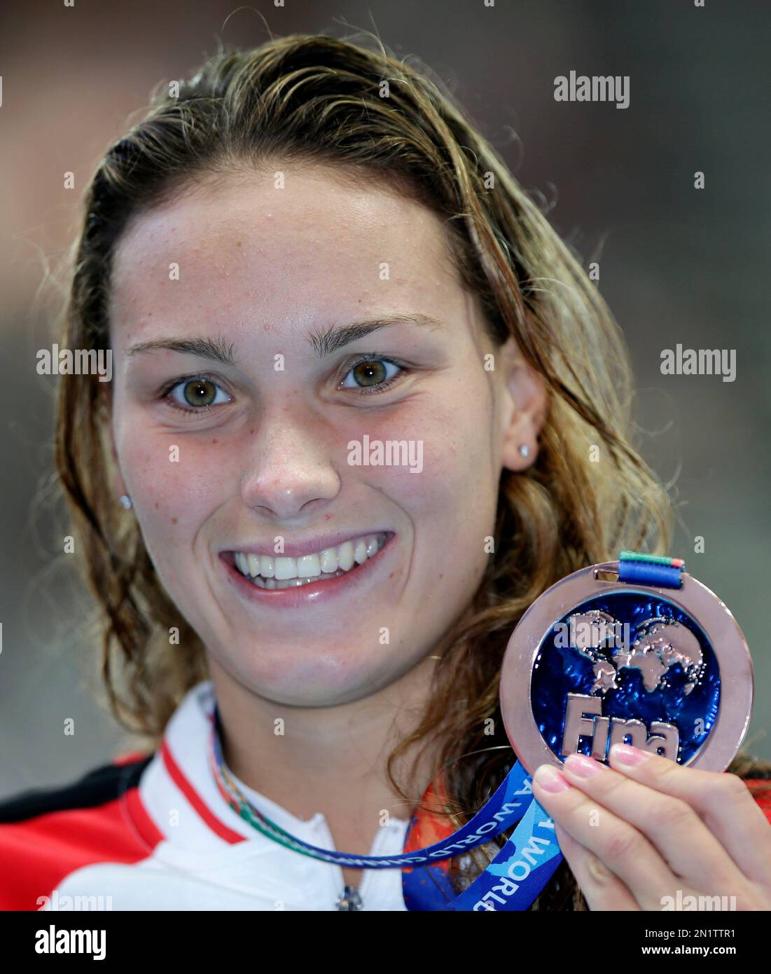 Denmark's Mie Oe Nielsen holds up her bronze medal after her third ...