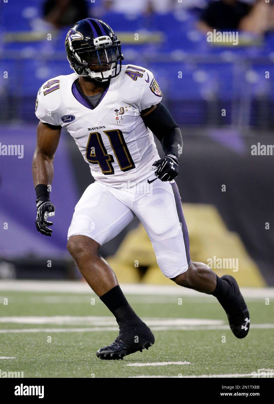 Baltimore Ravens cornerback Anthony Levine runs on the field during NFL ...