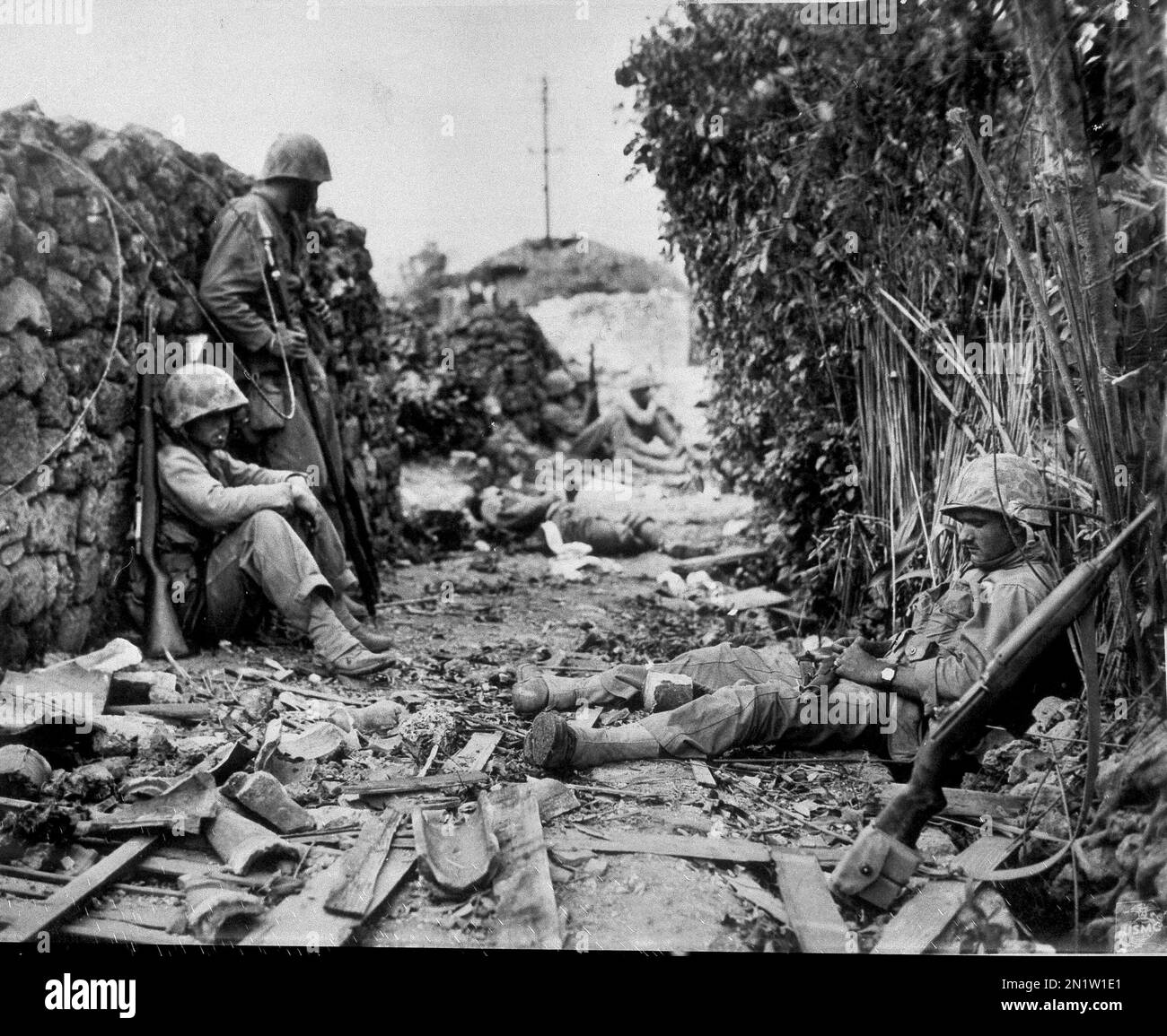 In this photo provided by the U.S. Marine Corps, tired Sixth Marine ...