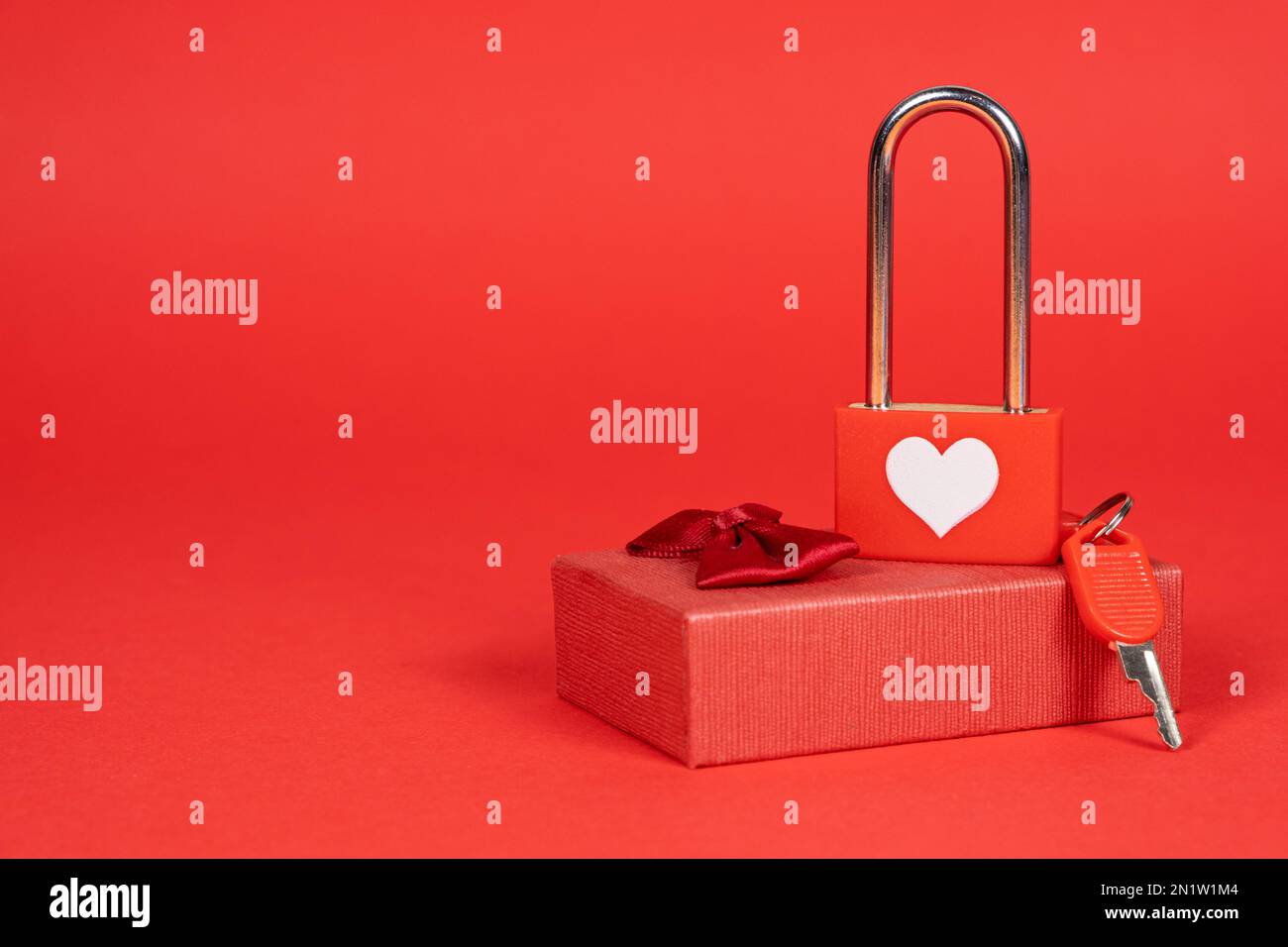 Valentine's Day Card - lock with keys on a gift box on a red background ...