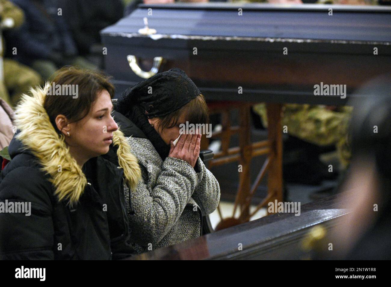 KYIV, UKRAINE - FEBRUARY 6, 2023 - A woman cries during the memorial ...