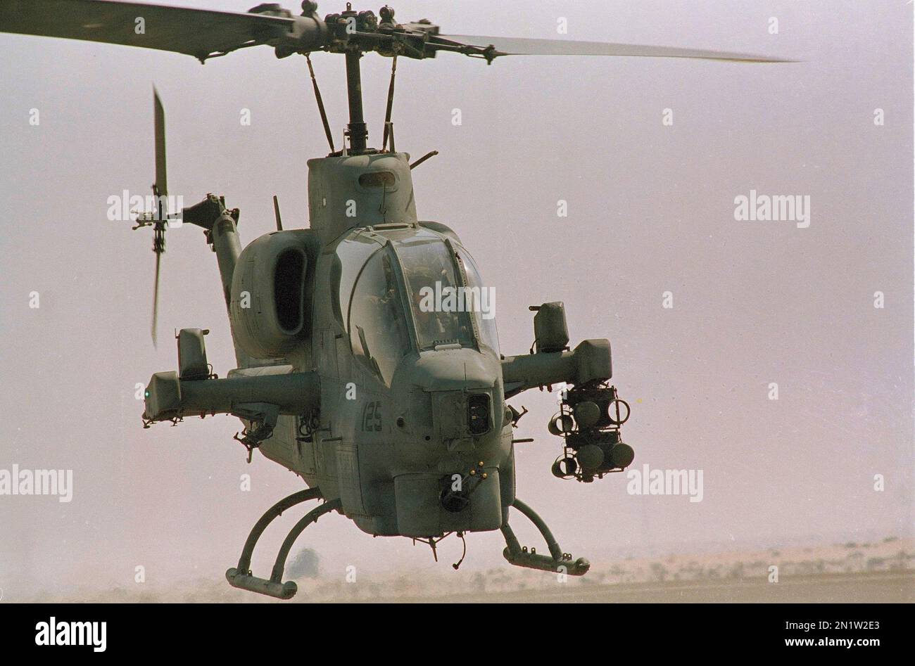 Bell AH-1T improved Sea Cobra attack helicopter flies over the Saudi ...