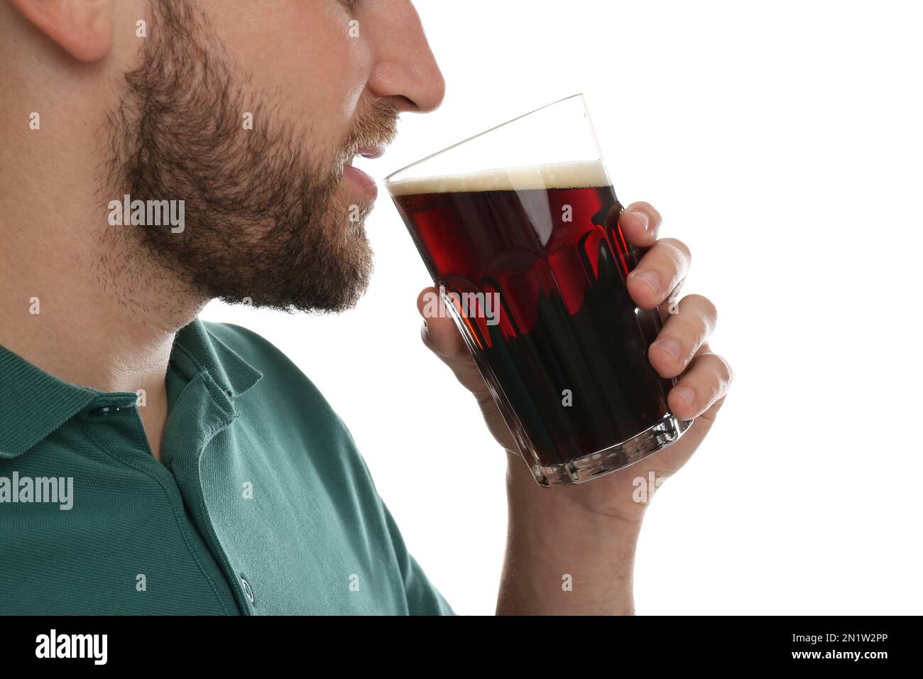 Young man with cold kvass on white background, closeup. Traditional ...