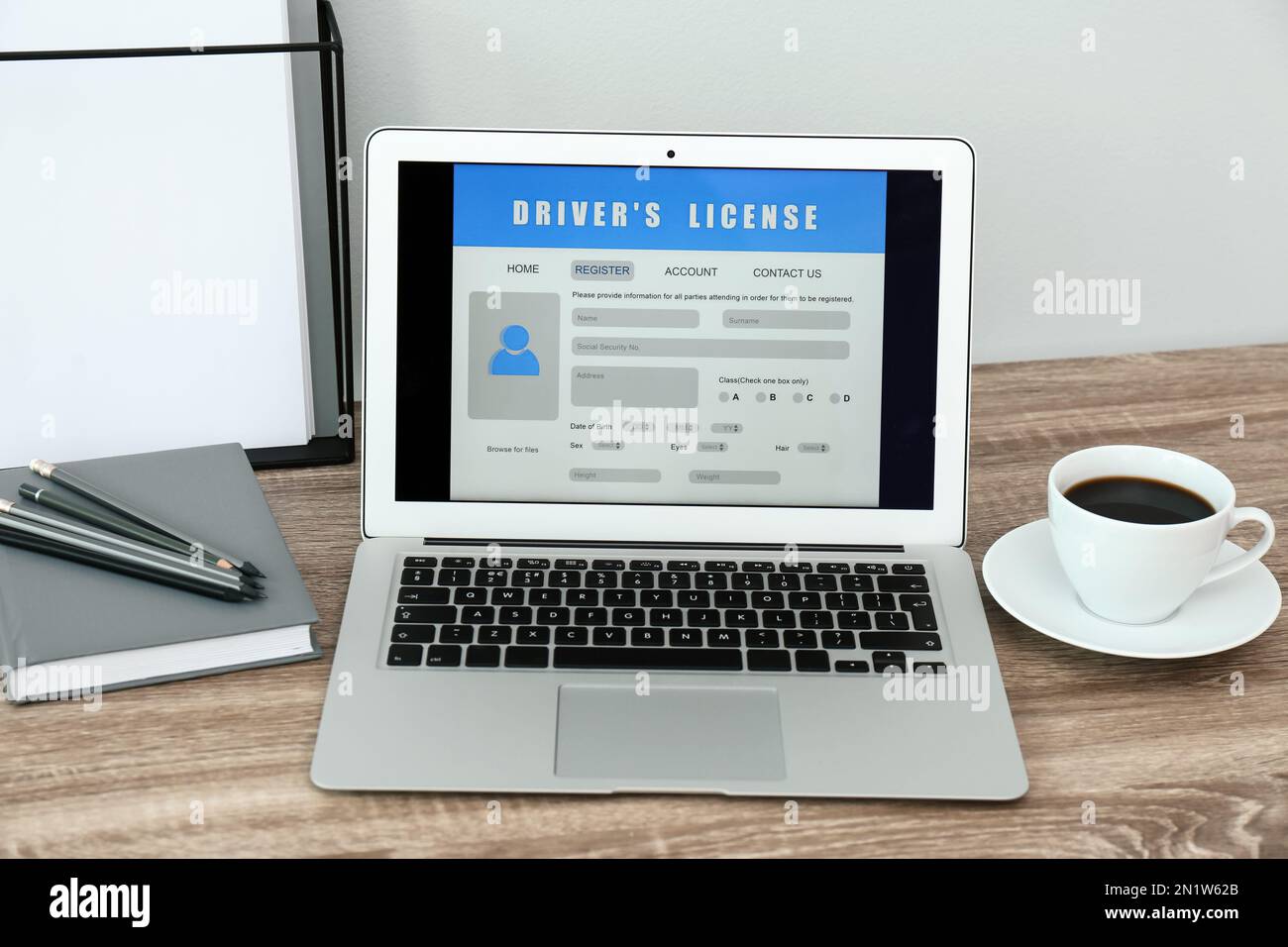 Laptop with driver's license application form on table in office Stock Photo - Alamy