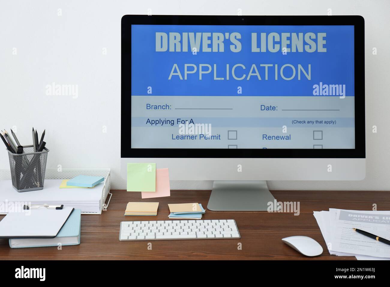 Computer with driver's license application form on table in office Stock Photo - Alamy