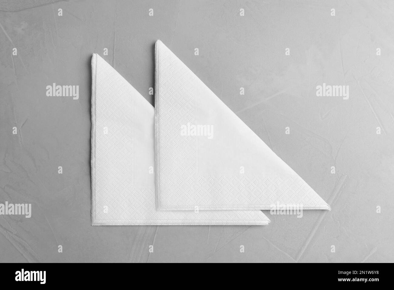 Clean napkins on light table, top view Stock Photo - Alamy