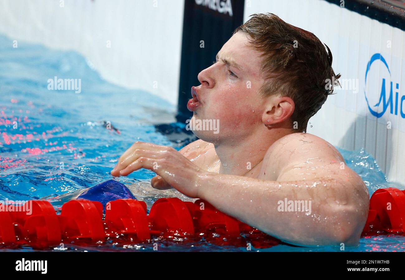 Britain's Adam Peaty checks the timing board after setting a new ...