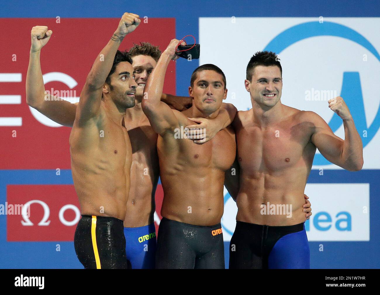 The Italian team celebrate after taking the bronze medal in the men's ...