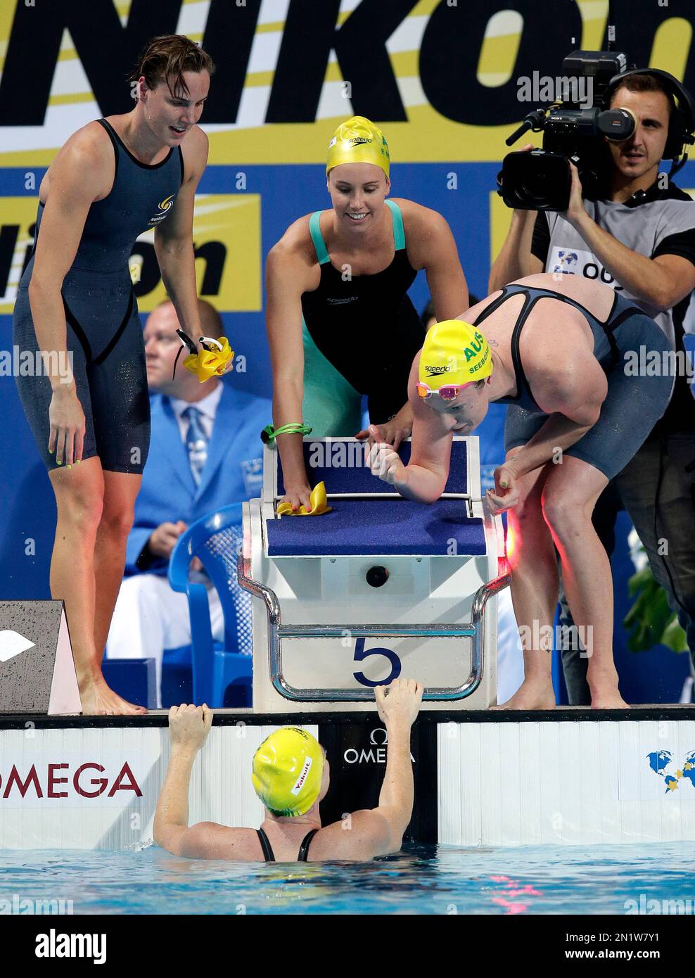 Australian team members celebrate after winning the women's 4x100m ...